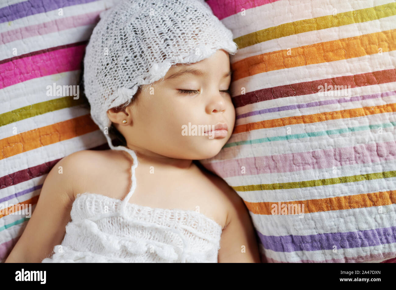 Calm sleeping baby girl above top view on colorful background Stock ...