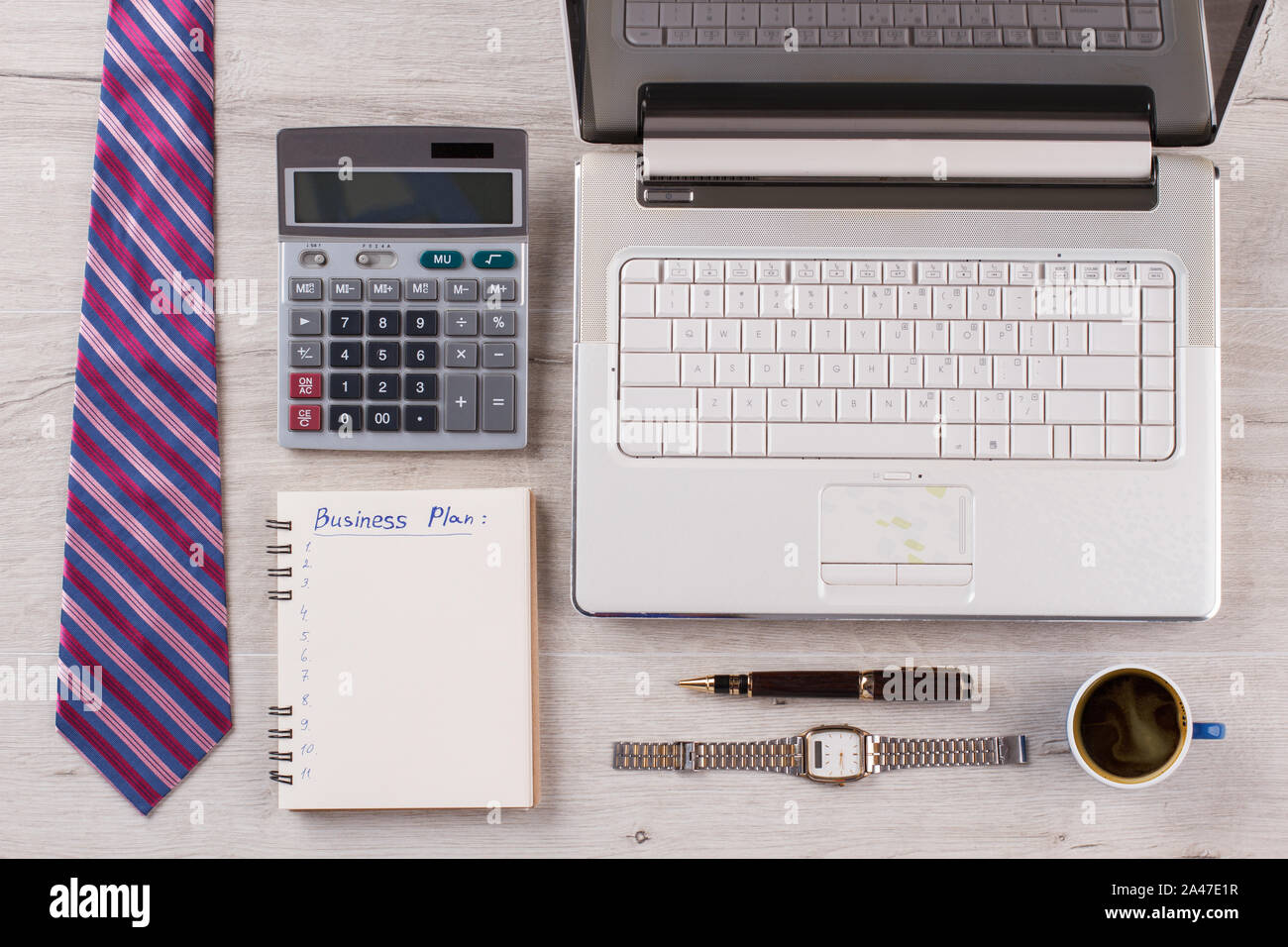 Americano, laptop and watch Stock Photo - Alamy