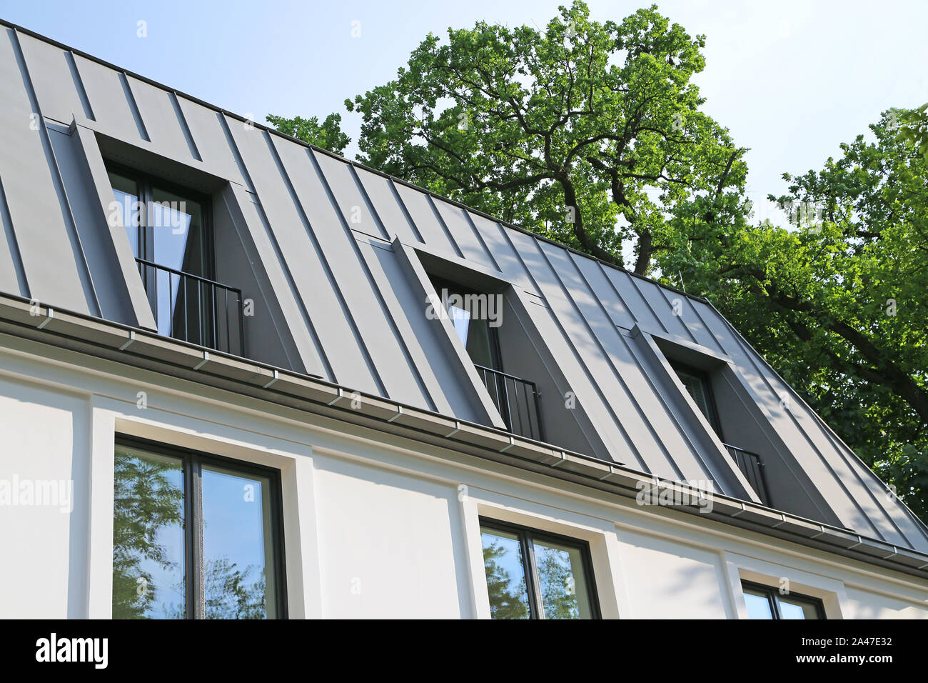 attic of a modern building with zinc cladding Stock Photo - Alamy