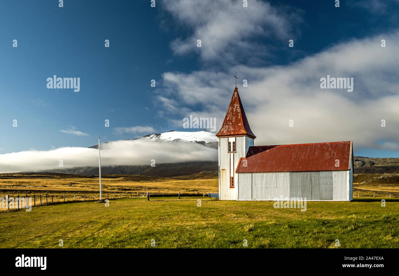 Disused Icelandic Church at Hellnar with white walls and a red roof and ...