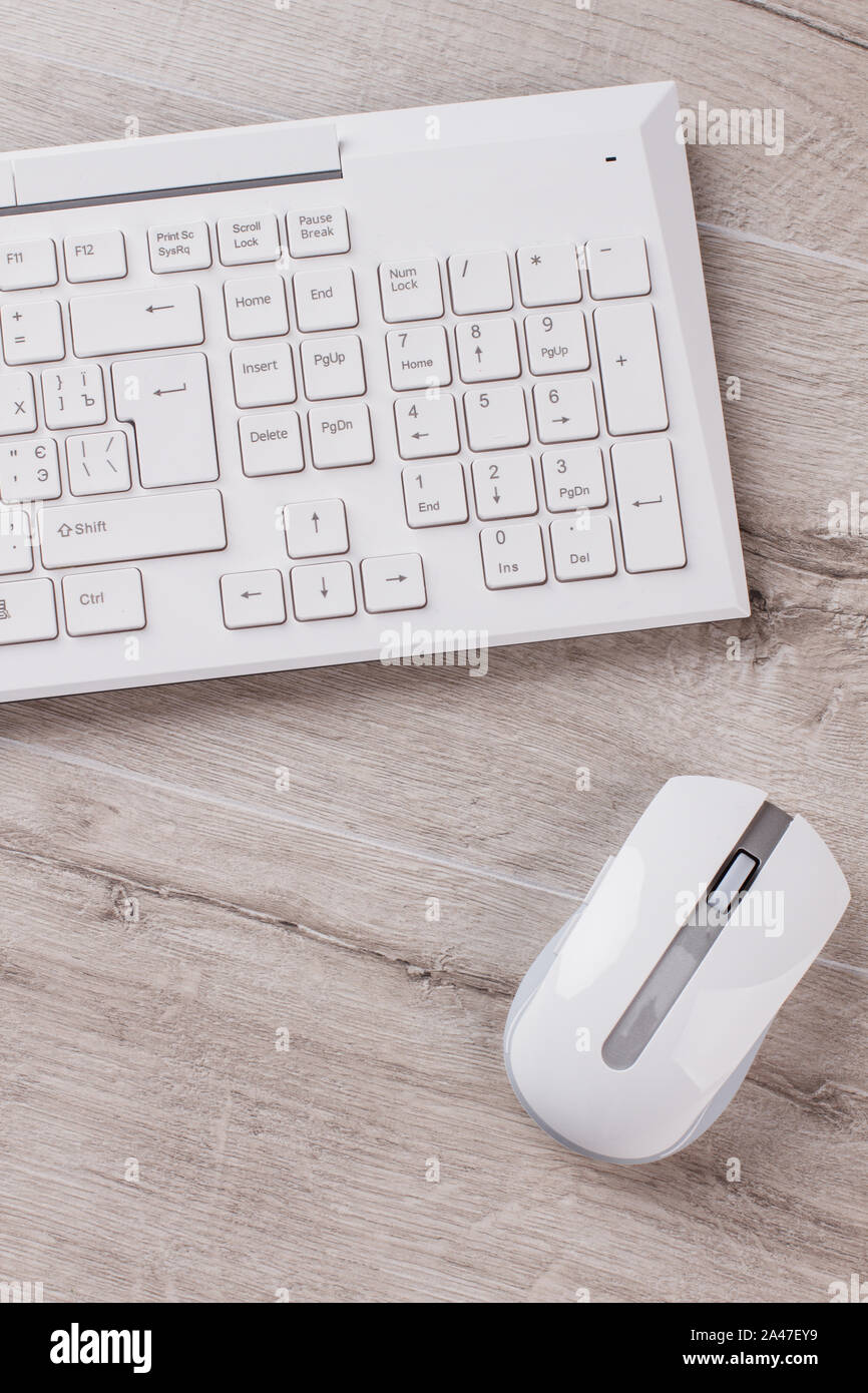 White keyboard and optical mouse on table detaild Stock Photo - Alamy