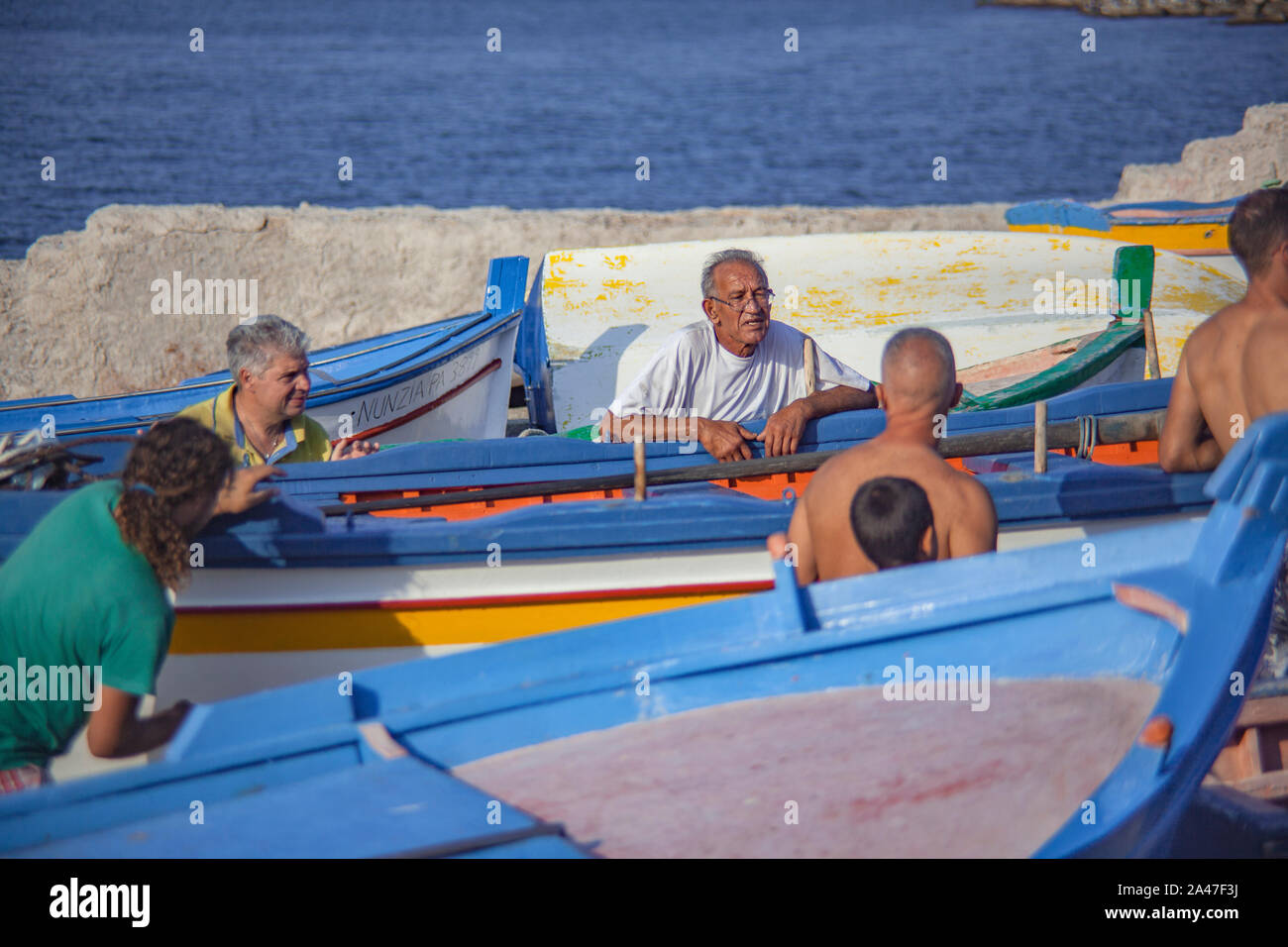 Men drag boat Stock Photo - Alamy