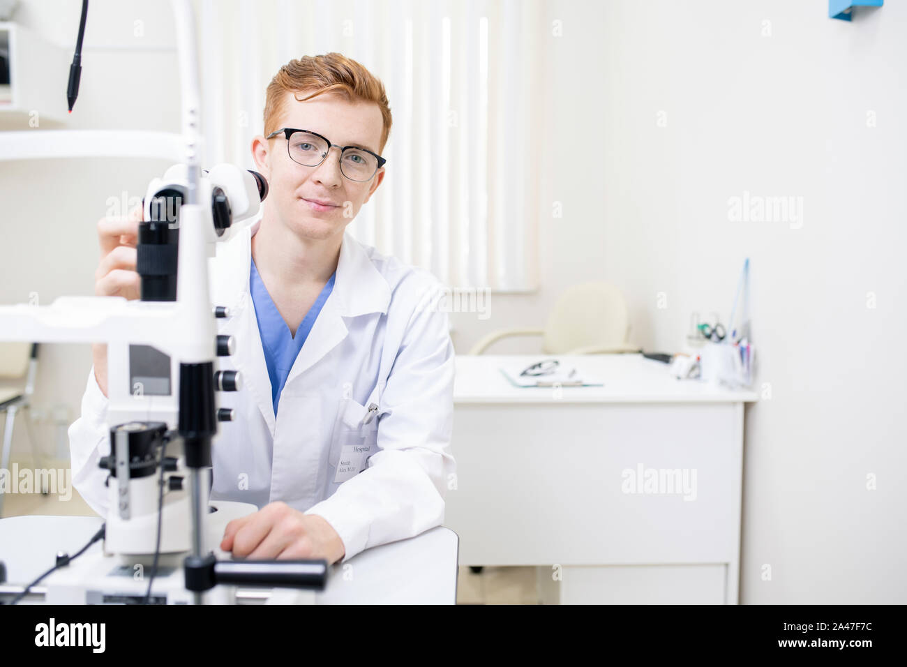 Cheerful doctor testing new hi-res stock photography and images - Alamy