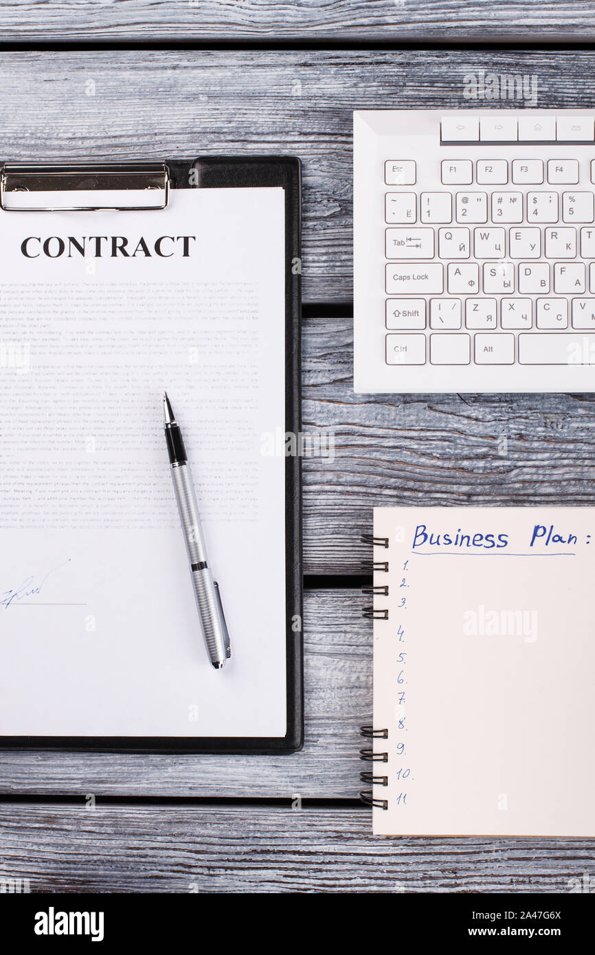 Signed contract with pen Stock Photo - Alamy