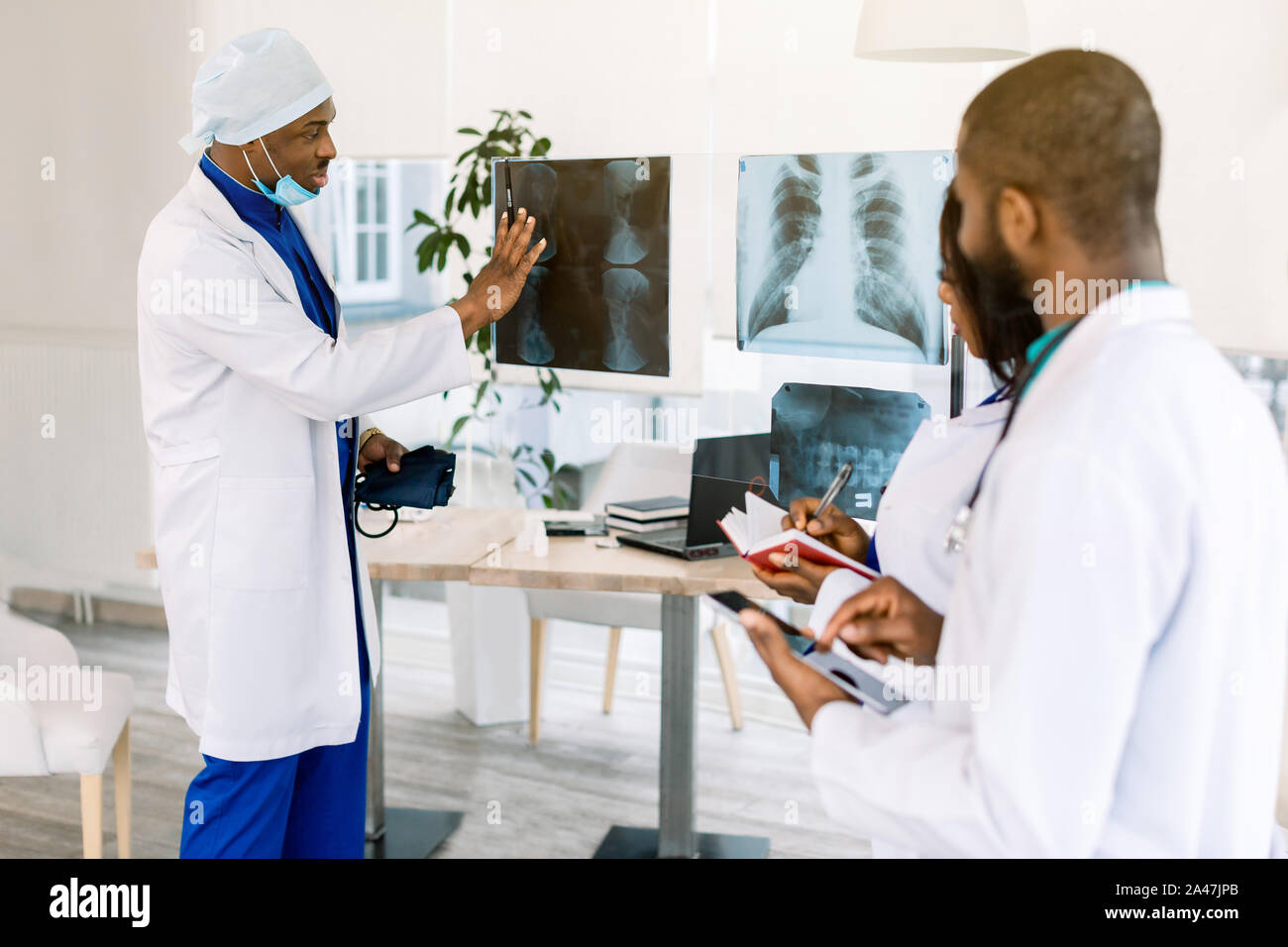 Healthcare, medical: Group of African doctors discuss and looking x-ray ...