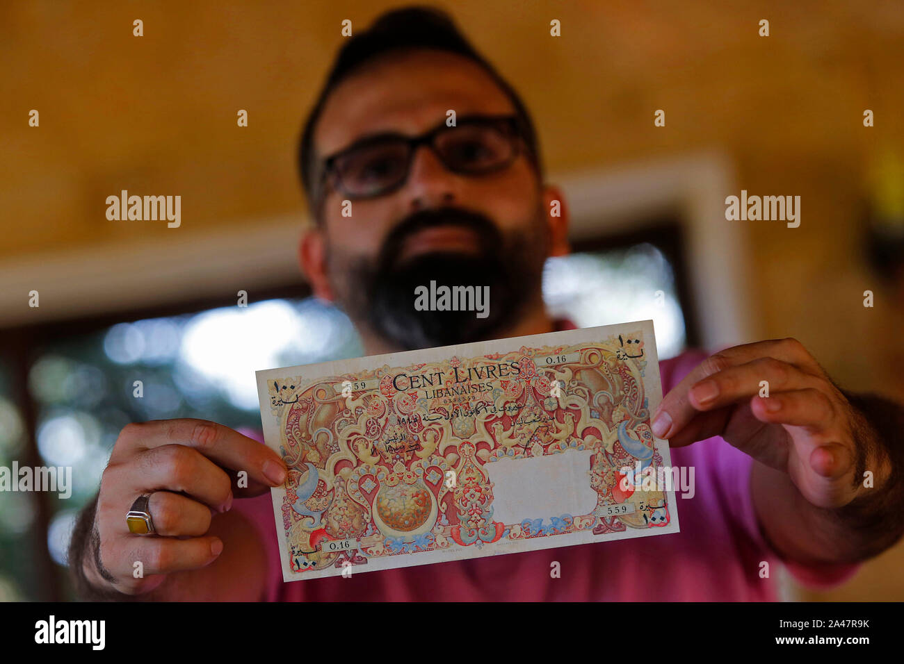 Chakra, Lebanon. 12th Oct, 2019. Wissam Ali Youssef shows an old ...