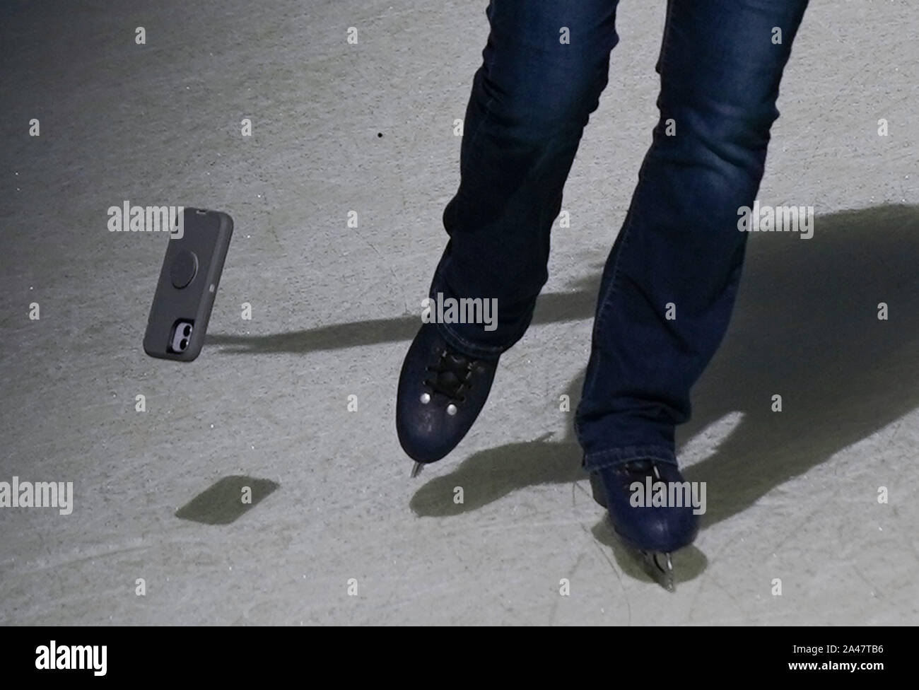 New York, USA. 12th Oct, 2019. A skater drops her Apple iPhone 11 when ...