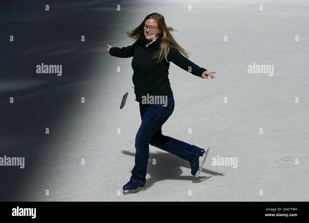New York, USA. 12th Oct, 2019. A skater drops her Apple iPhone 11 when ...