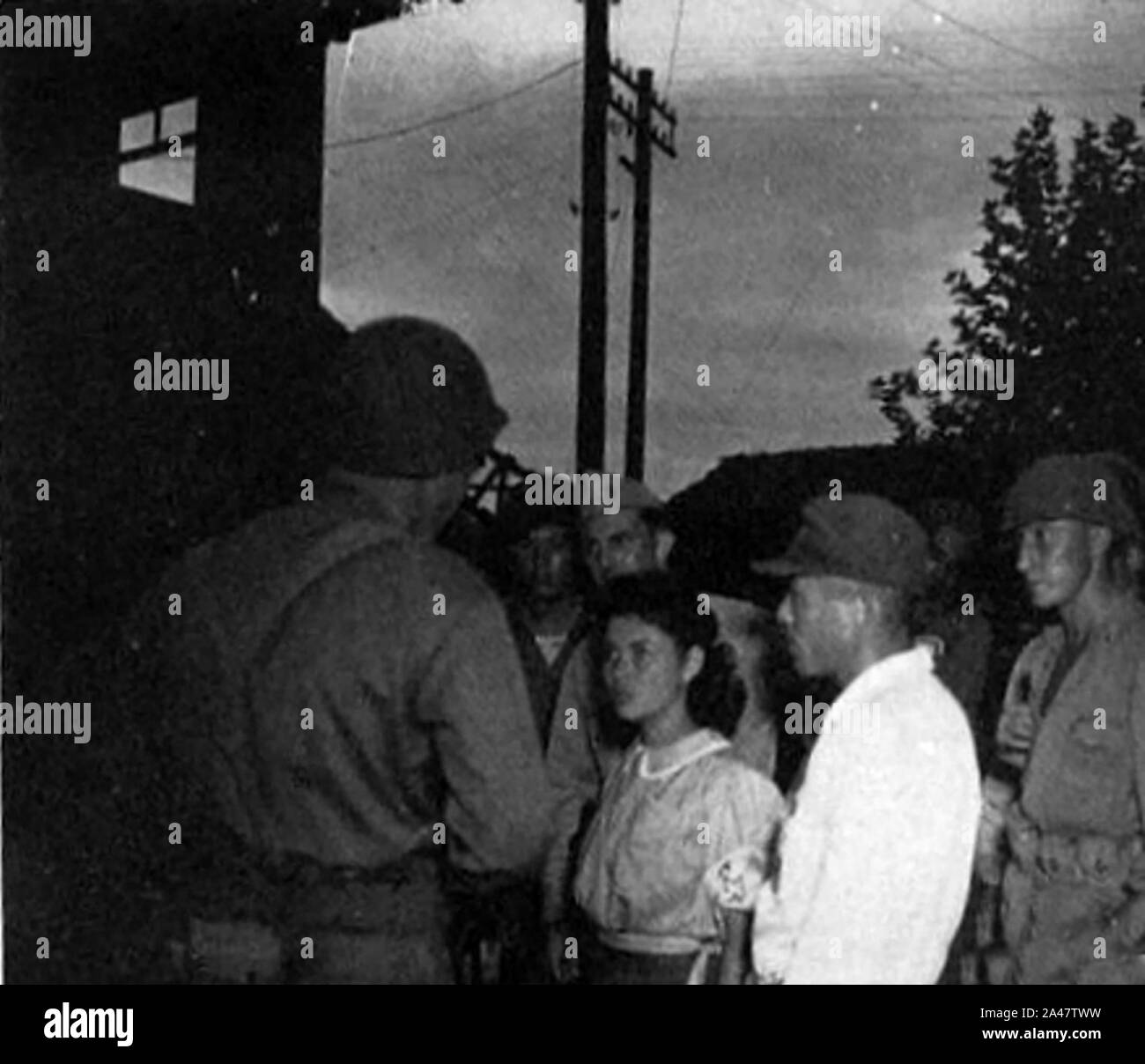 Female Japanese interpreter with U.S. soldiers in Nagasaki, in ...
