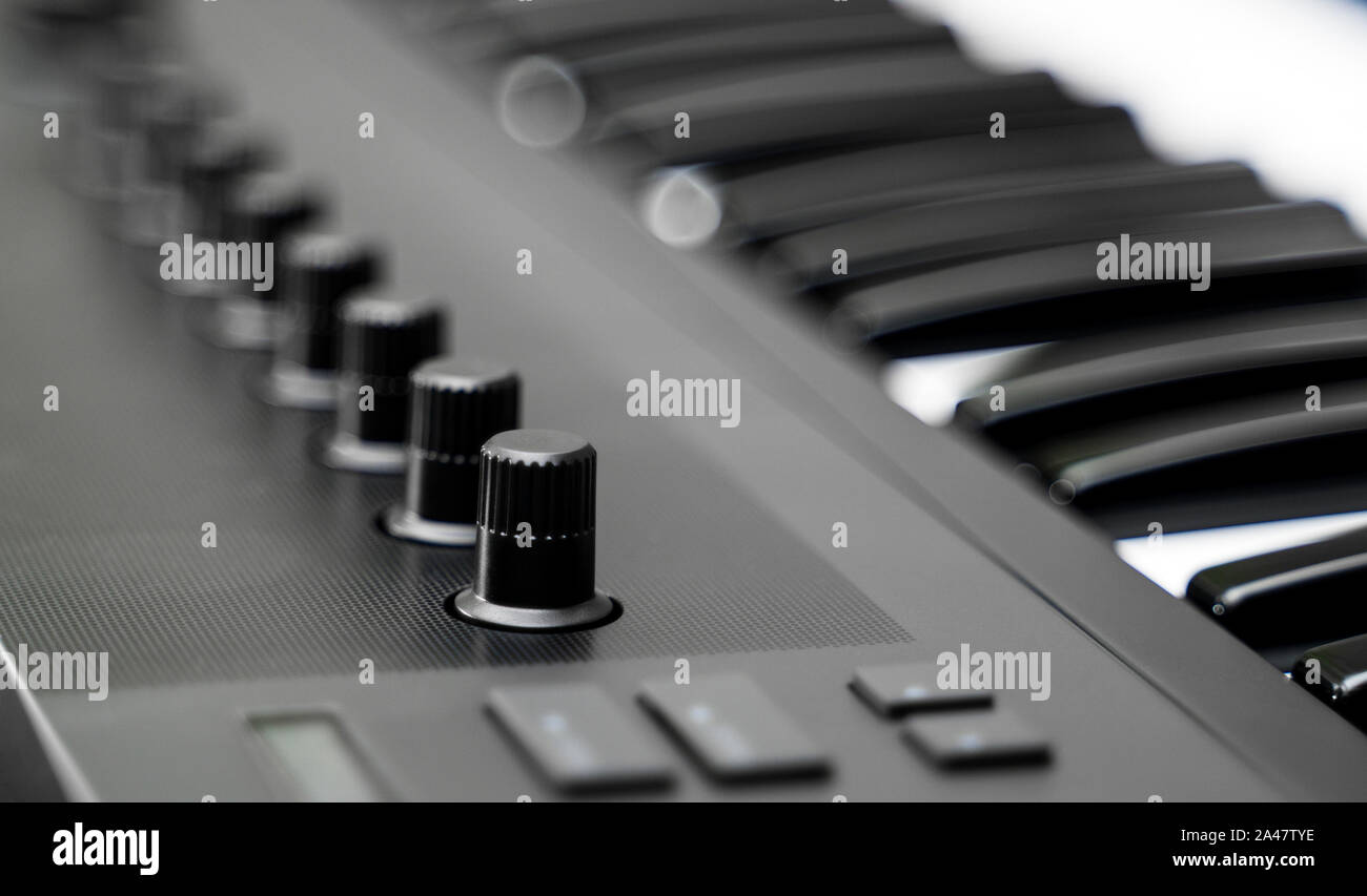 Professional midi keyboard synthesizer with knobs and controllers Stock ...