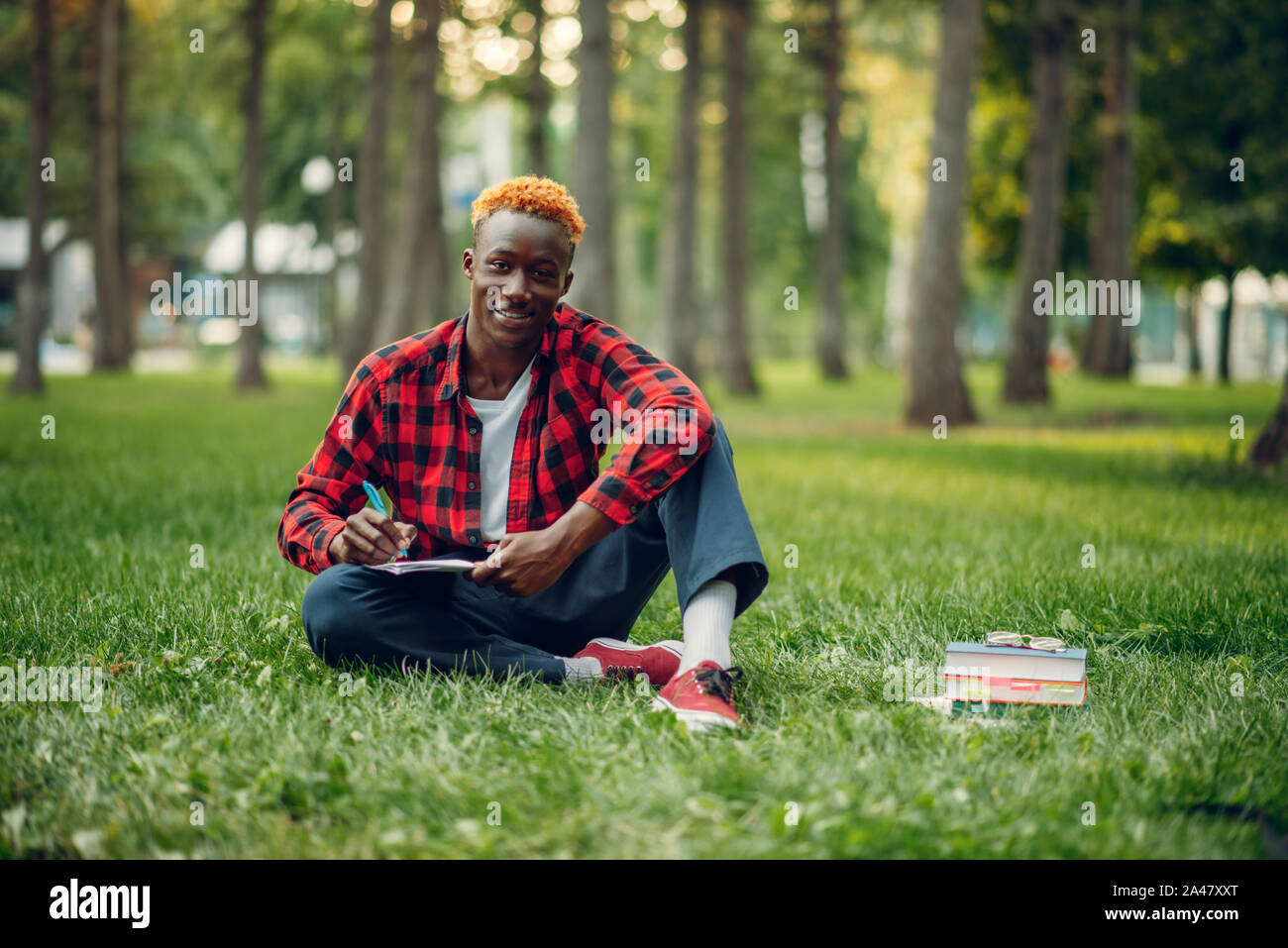 Black student writing hi-res stock photography and images - Alamy