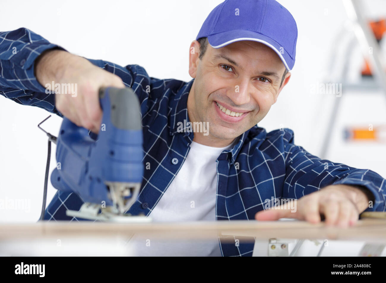 Engineer operating cutting machine hi-res stock photography and images ...