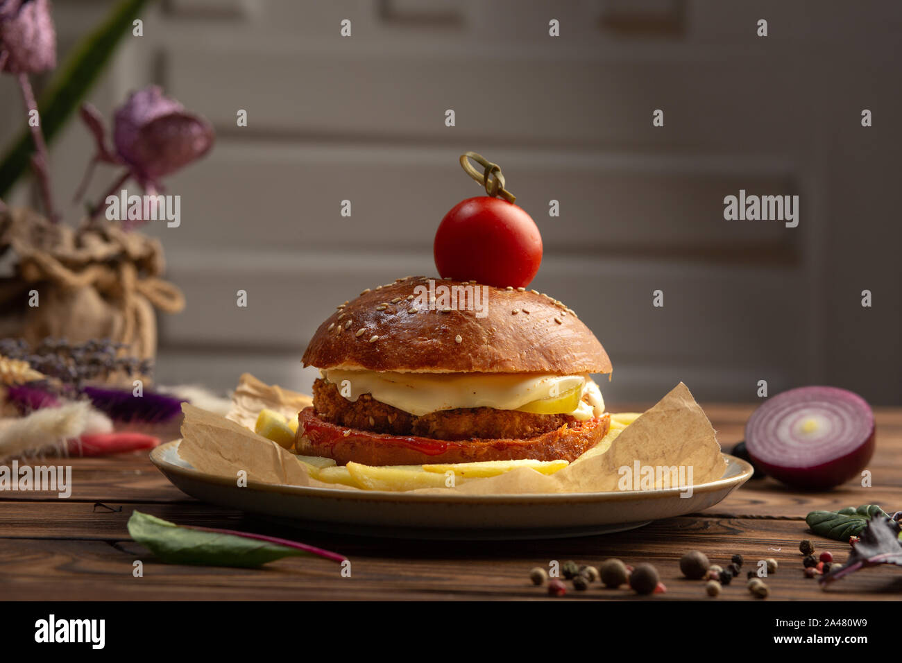 Cheeseburger from chopped beef cutlet with tomato. Light background ...