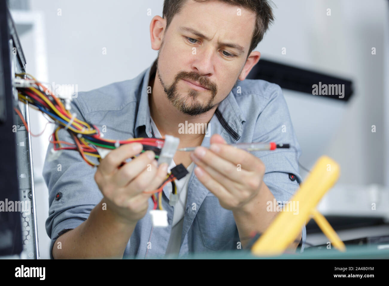 professional man repairing and assembling a computer Stock Photo - Alamy