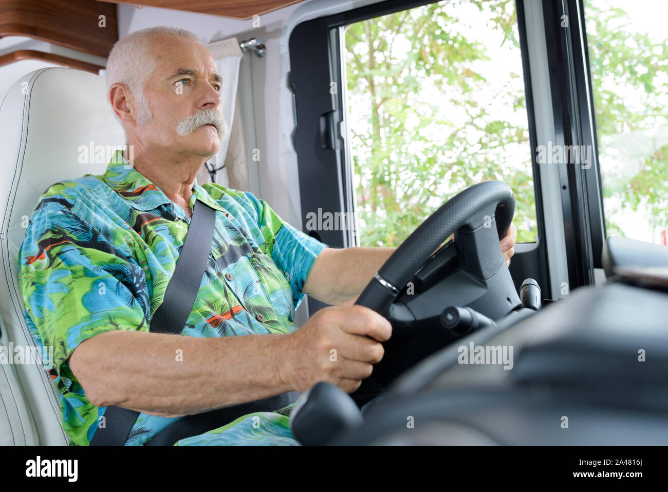 senior man driving a camper van Stock Photo - Alamy