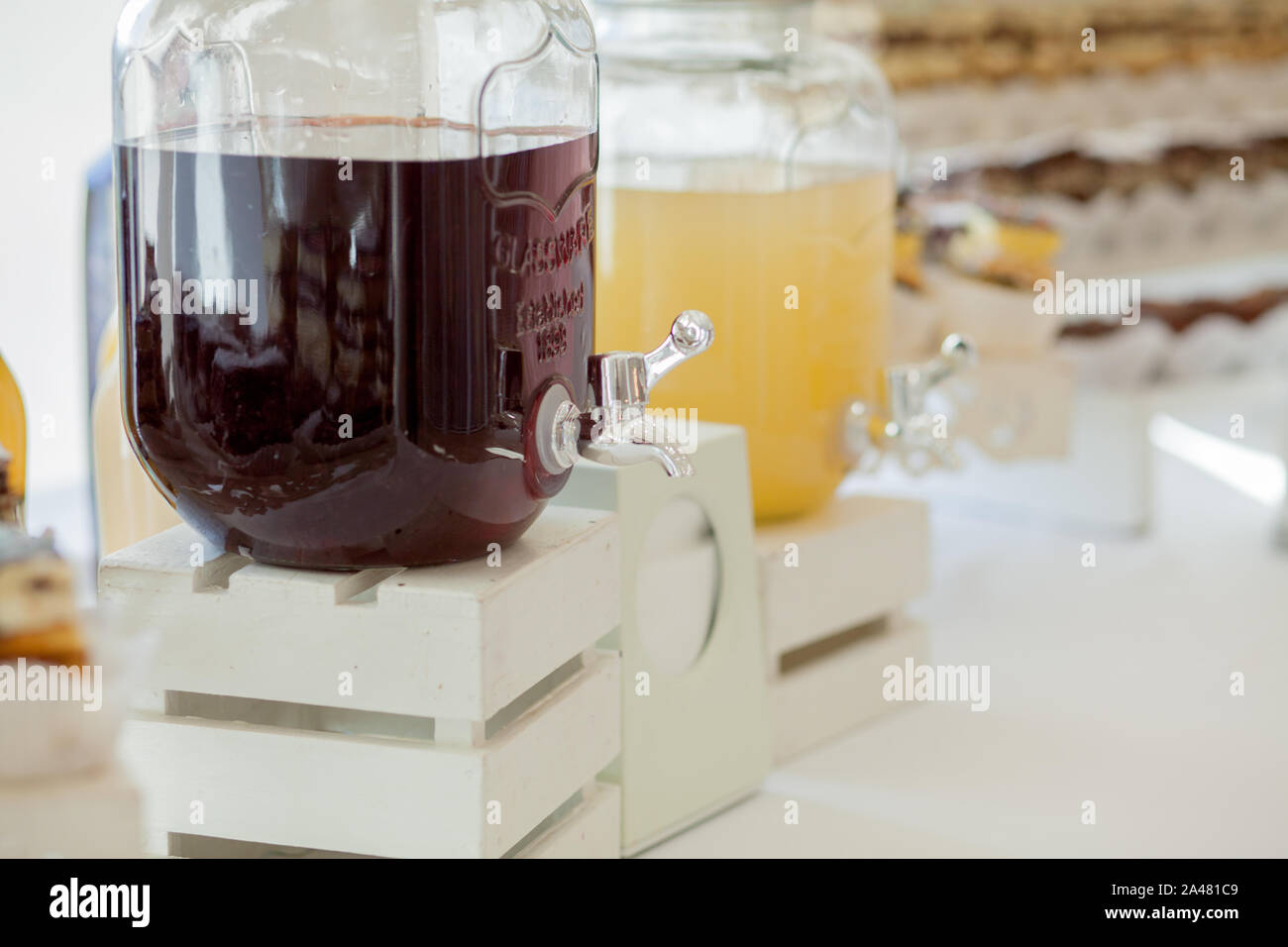 Glass jars of lemonade on wedding candy bar. Catering. Drinks on ...