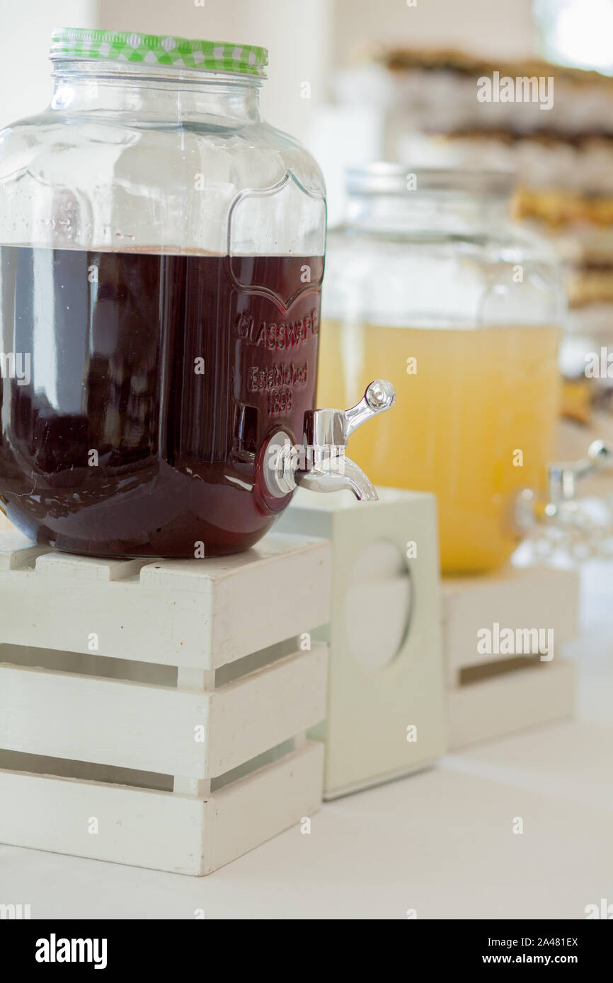 Glass jars of lemonade on wedding candy bar. Catering. Drinks on ...