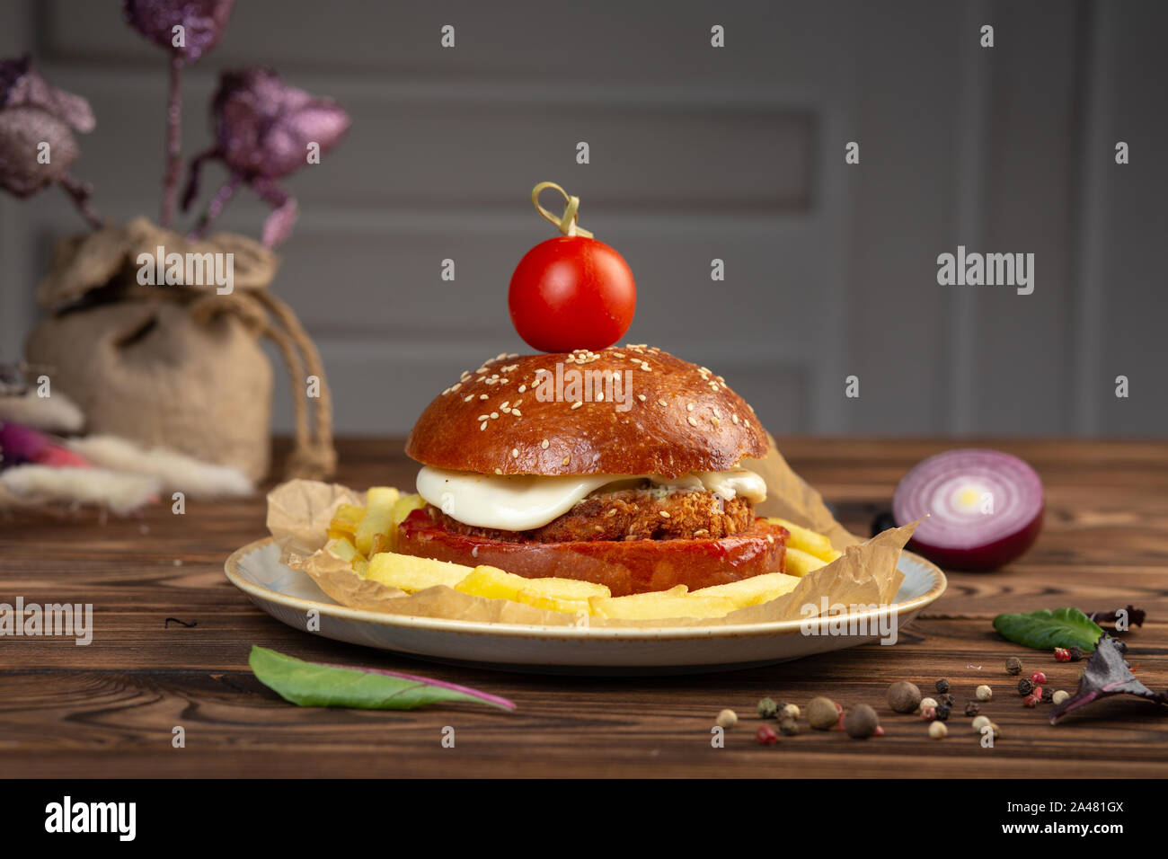 Cheeseburger from chopped beef cutlet with tomato. Light background ...