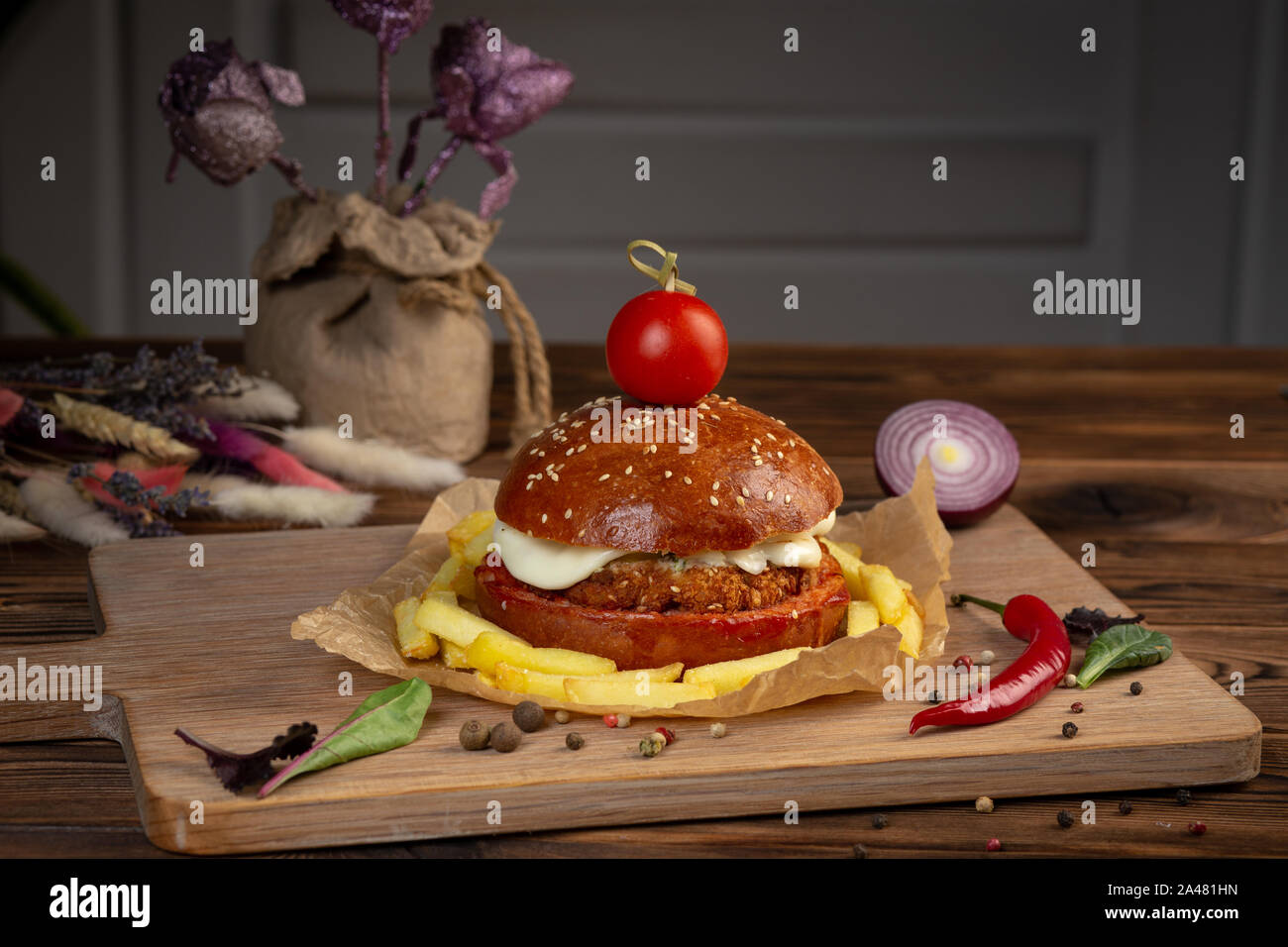 Cheeseburger from chopped beef cutlet with tomato. Light background ...