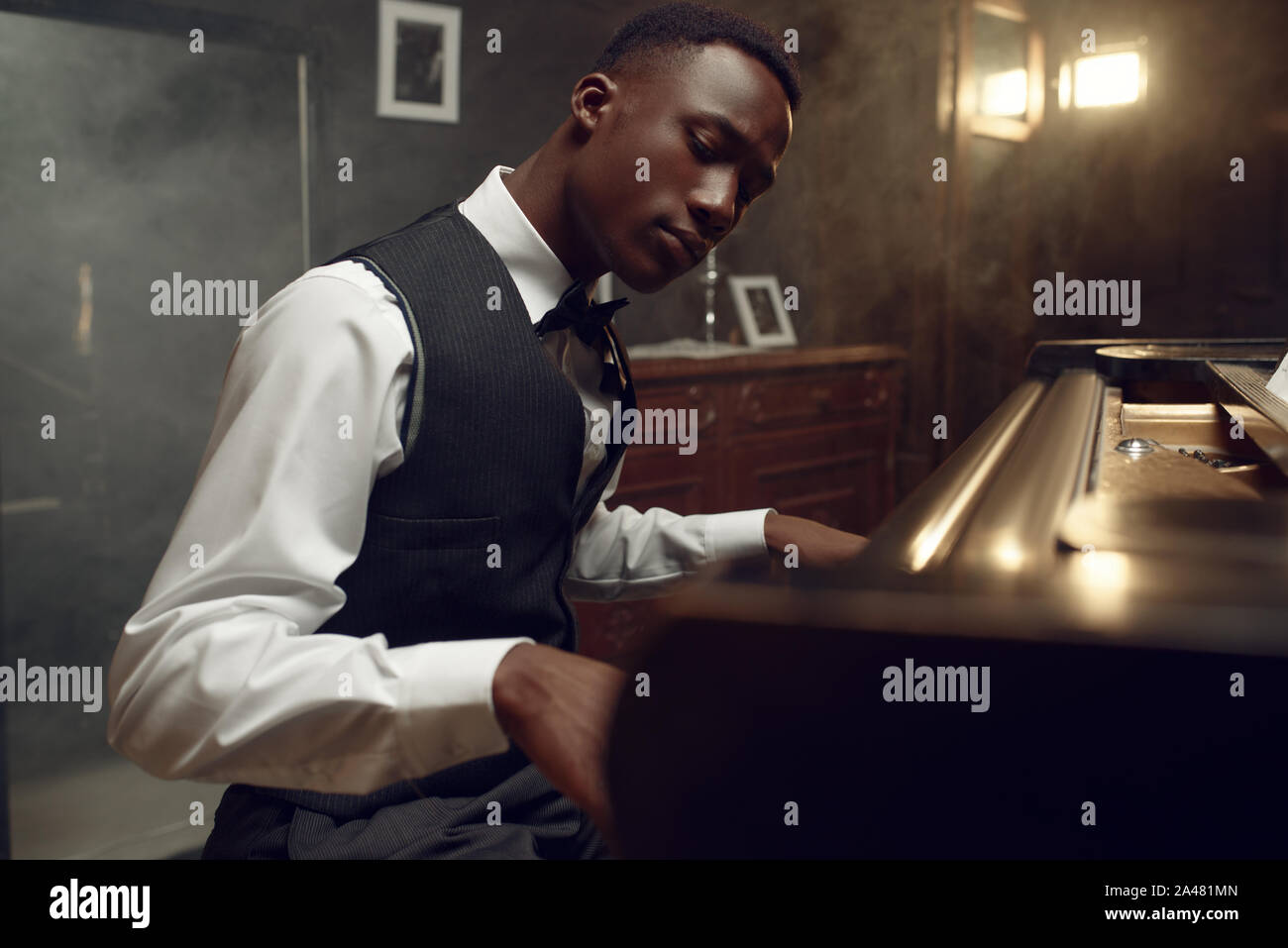 Ebony grand piano player, jazz performance Stock Photo - Alamy