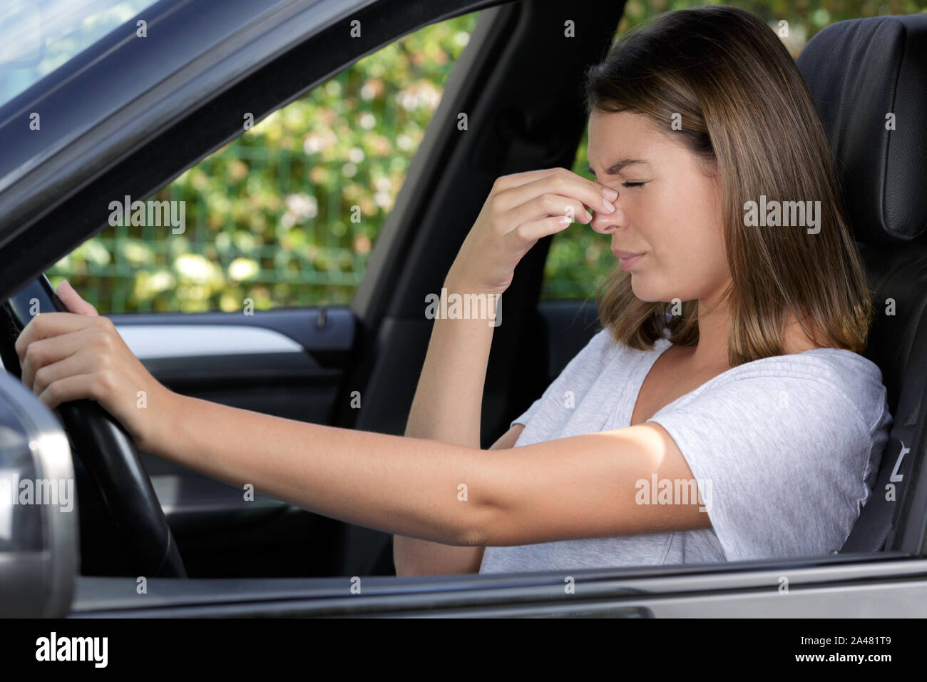 tired beautiful woman in her car Stock Photo - Alamy