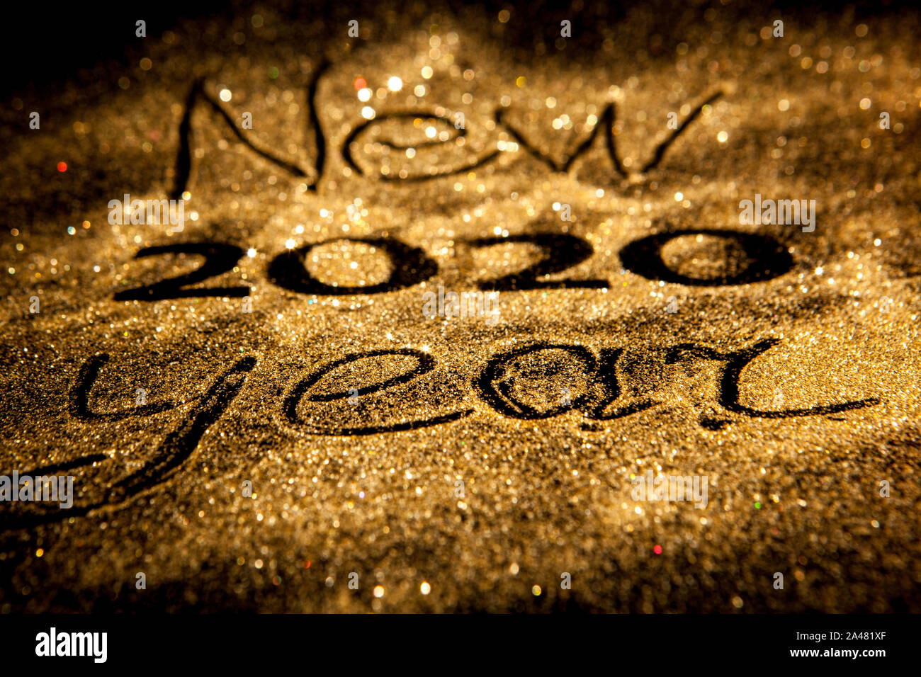 Happy New Year 2020. Beautiful sparkling Golden number 2020 on black ...