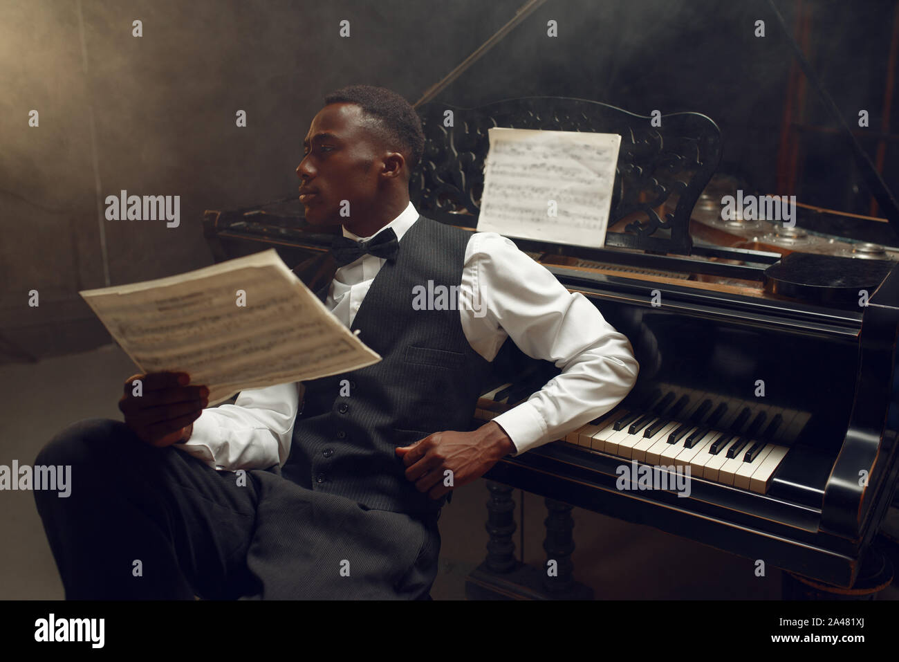Stylish ebony grand piano player, jazz performance Stock Photo - Alamy