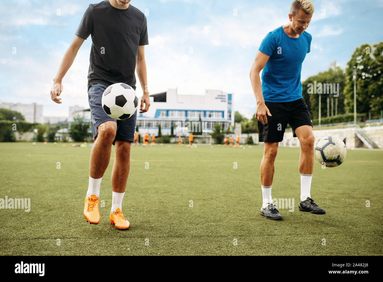 Ball at their feet hi-res stock photography and images - Alamy