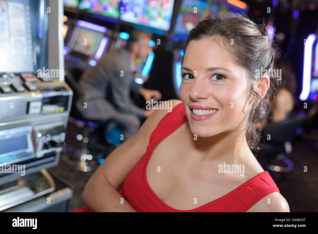 Man and woman playing gaming machine hi-res stock photography and ...