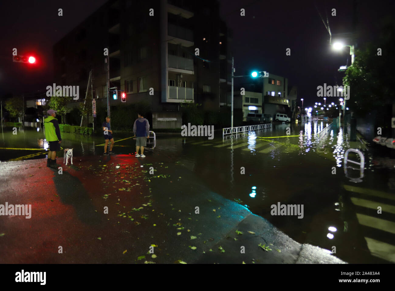 Tokyo, Japan. 12th Oct, 2019. A road is covered with flooded water at ...