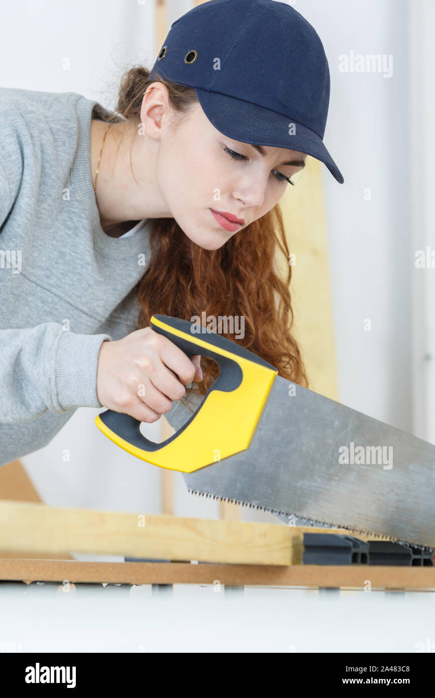 girl with hand saw Stock Photo - Alamy