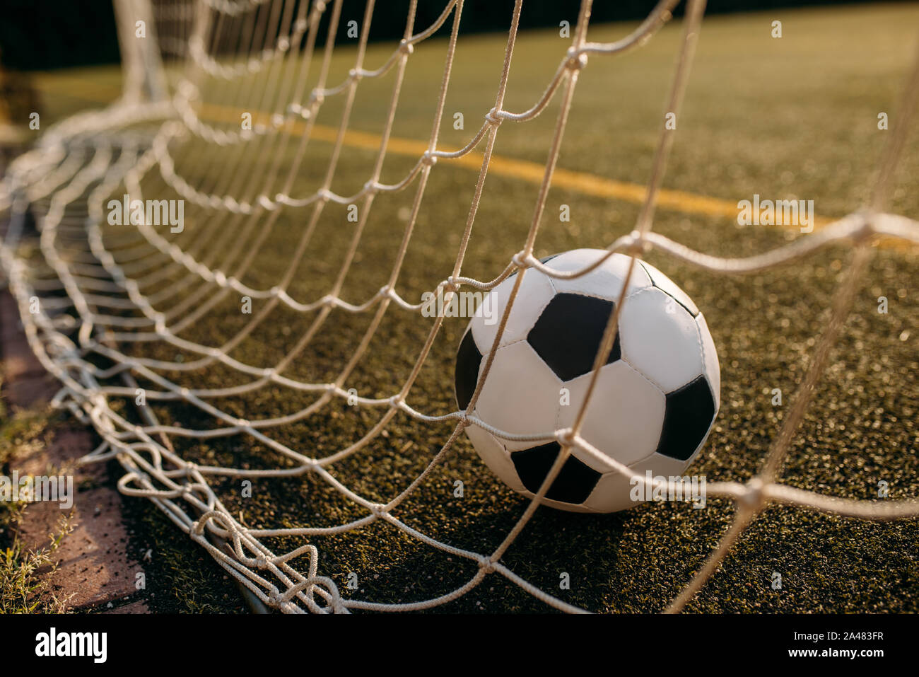 Soccer ball in the gate net, nobody Stock Photo - Alamy