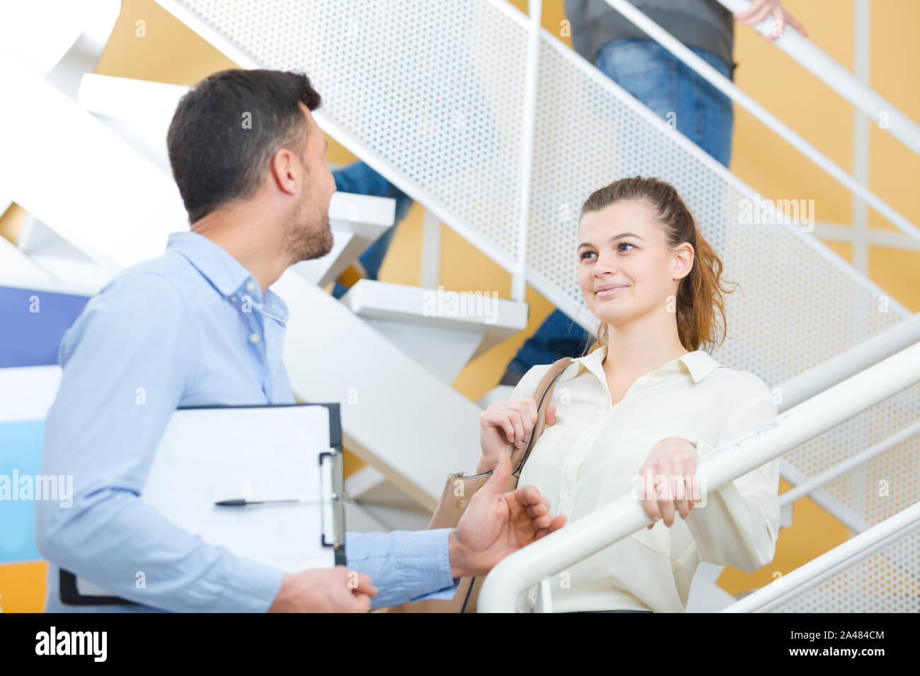 Teacher student talking hallway hi-res stock photography and images - Alamy