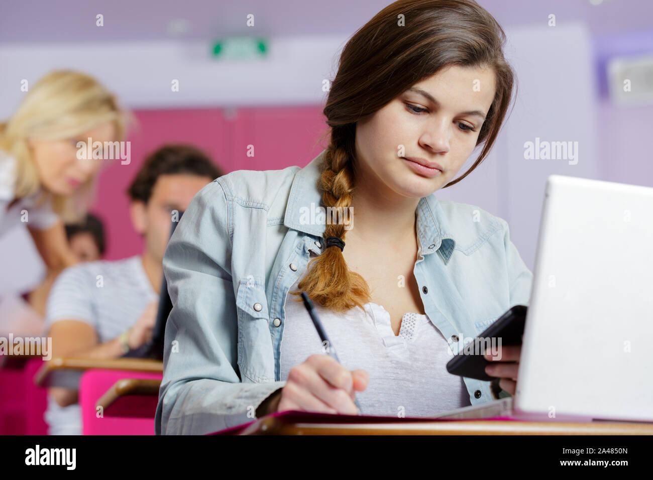 teacher teaches students using laptops in classroom Stock Photo - Alamy