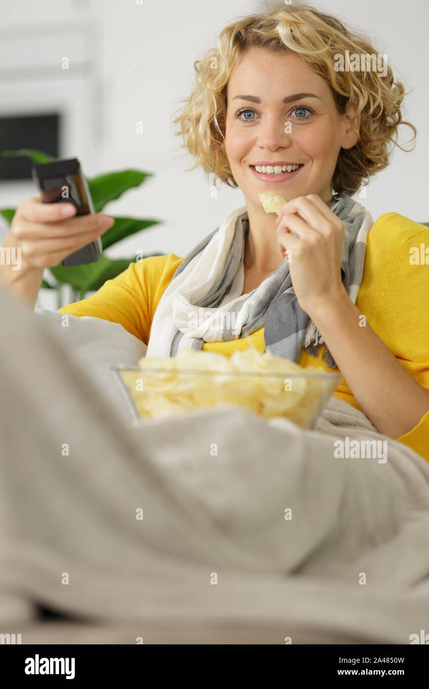 woman hand holds remote control tv Stock Photo - Alamy