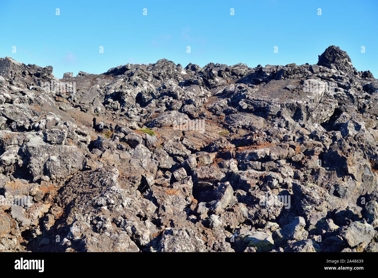 Svartsengi, Iceland. Hills of lava rock formations that surround the ...