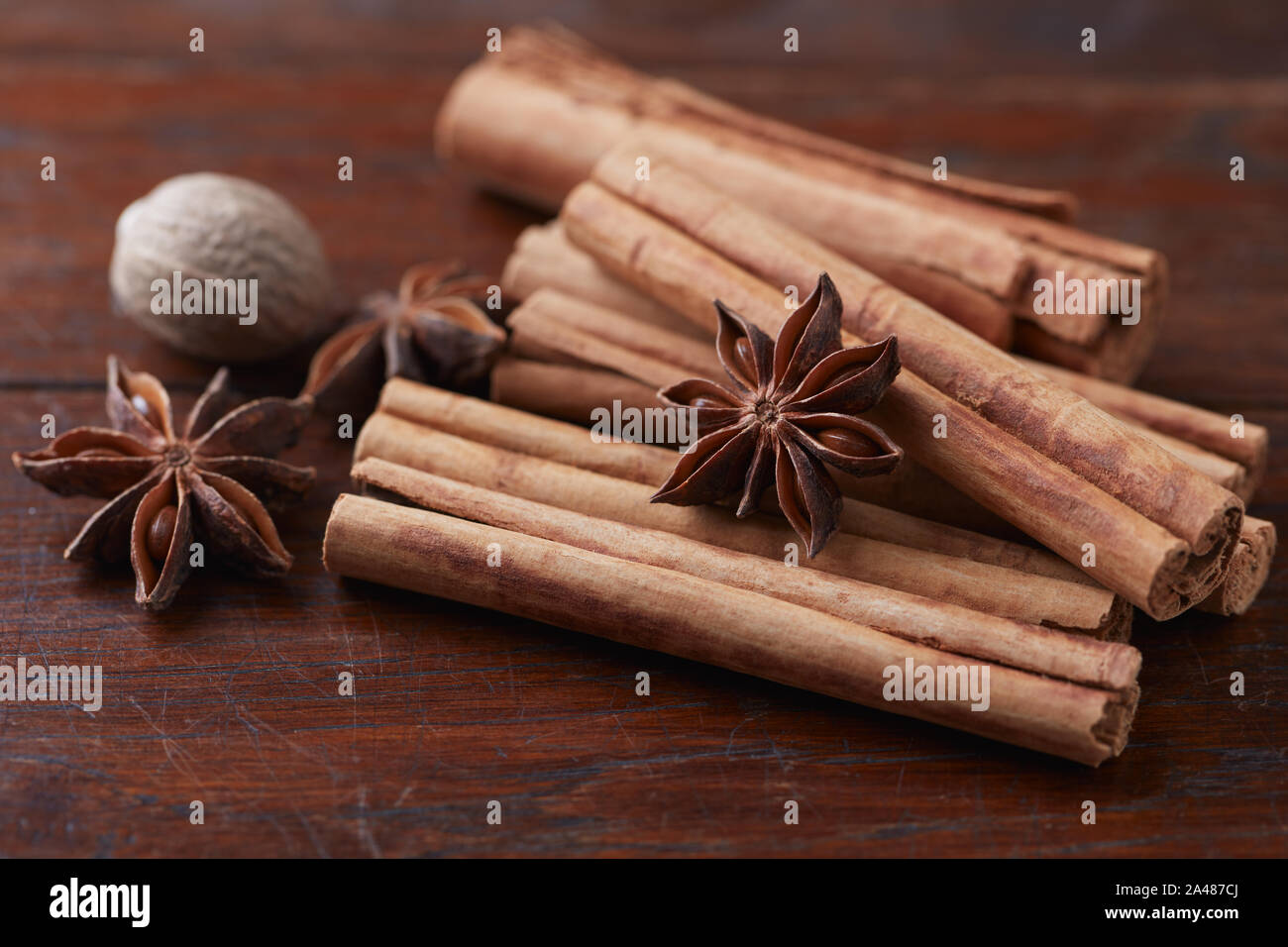 Star anise with cinnamon. Christmas spices on rustic wooden background ...