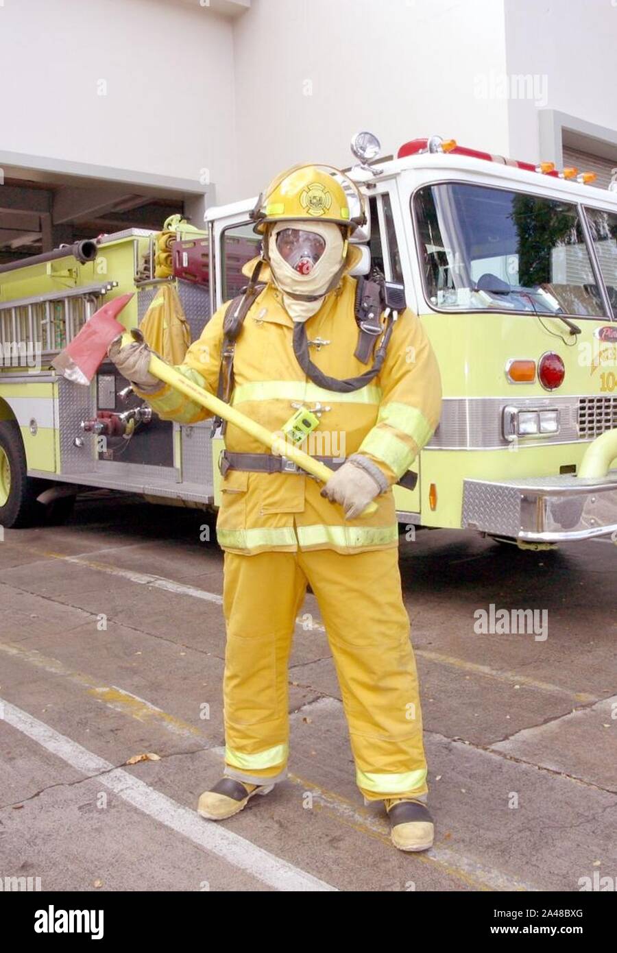 Firefighter with axe Stock Photo - Alamy