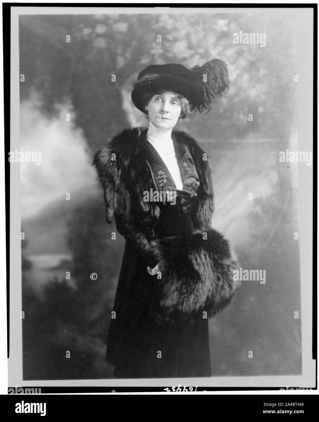 Florence H. Marshall, three-quarter length portrait, standing, facing ...