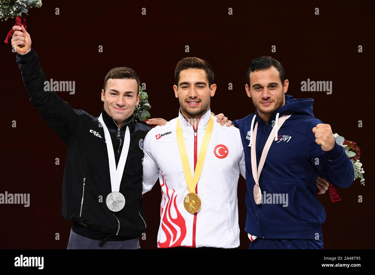 Stuttgart, Germany. 12th Oct, 2019. Gold medalist Ibrahim Colak (C)of ...