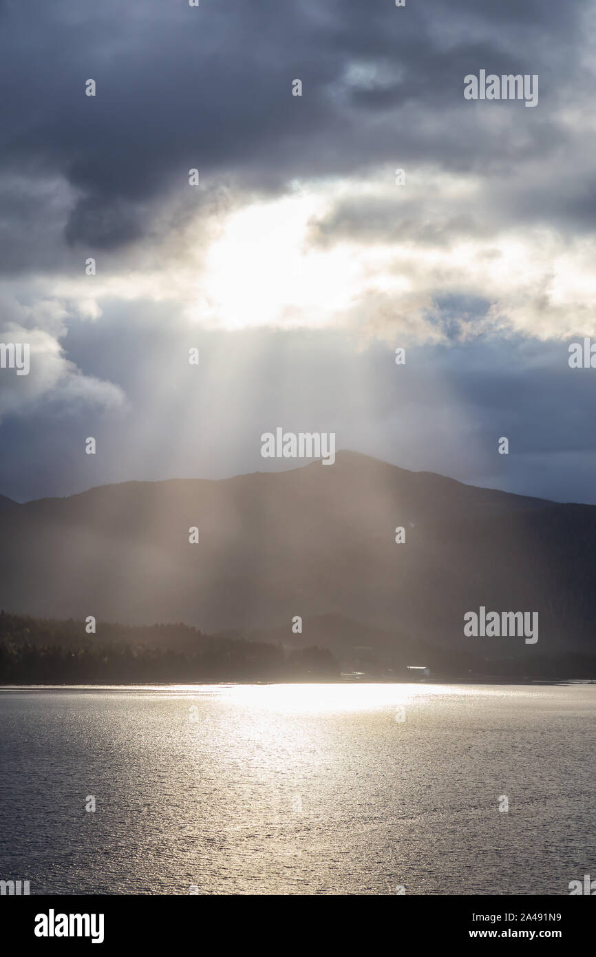 Dramatic clouds and sunlight during stormy weather over ocean hi-res ...