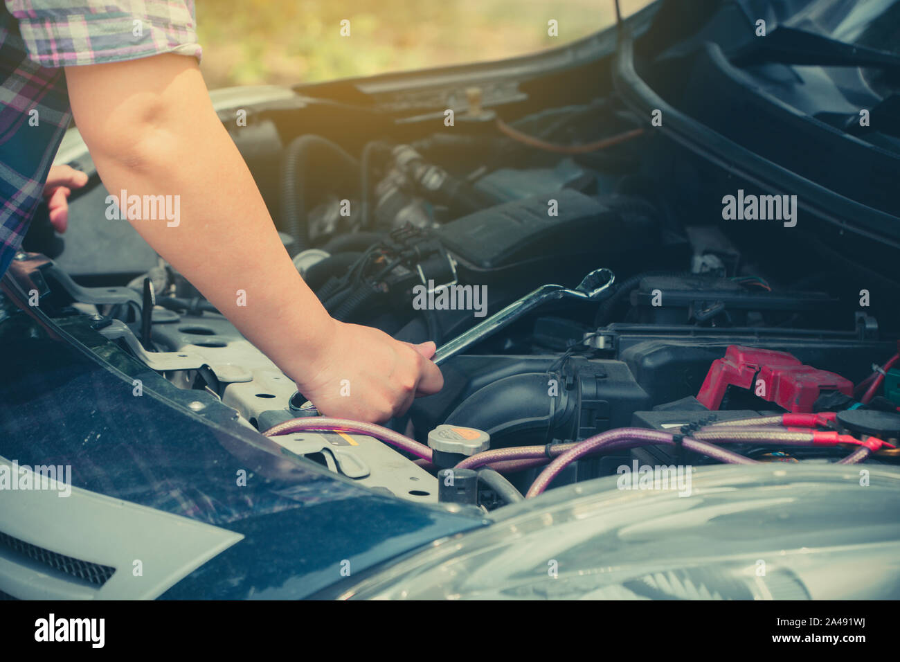 Car mechanic working in auto repair service at auto service center ...