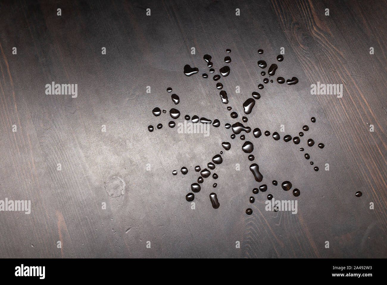 concept of spring thaw and melting snow, a snowflake made from water ...