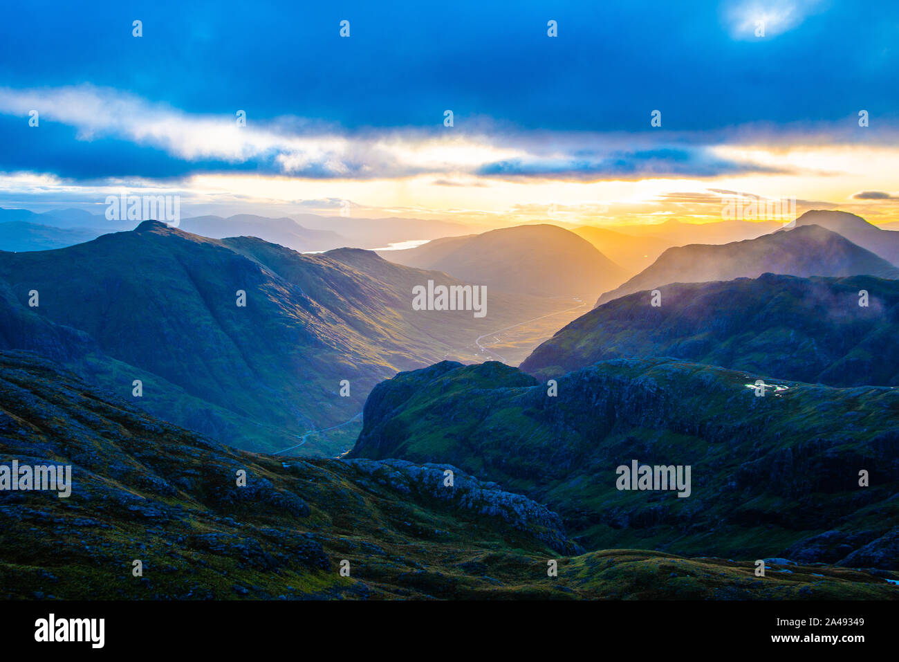 Glencoe mountain range during sunrise, highlands, Scotland Stock Photo ...