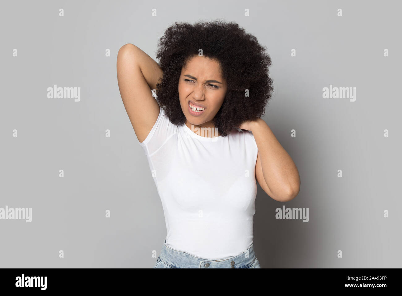 Unhealthy biracial girl suffer from painful back feeling Stock Photo ...
