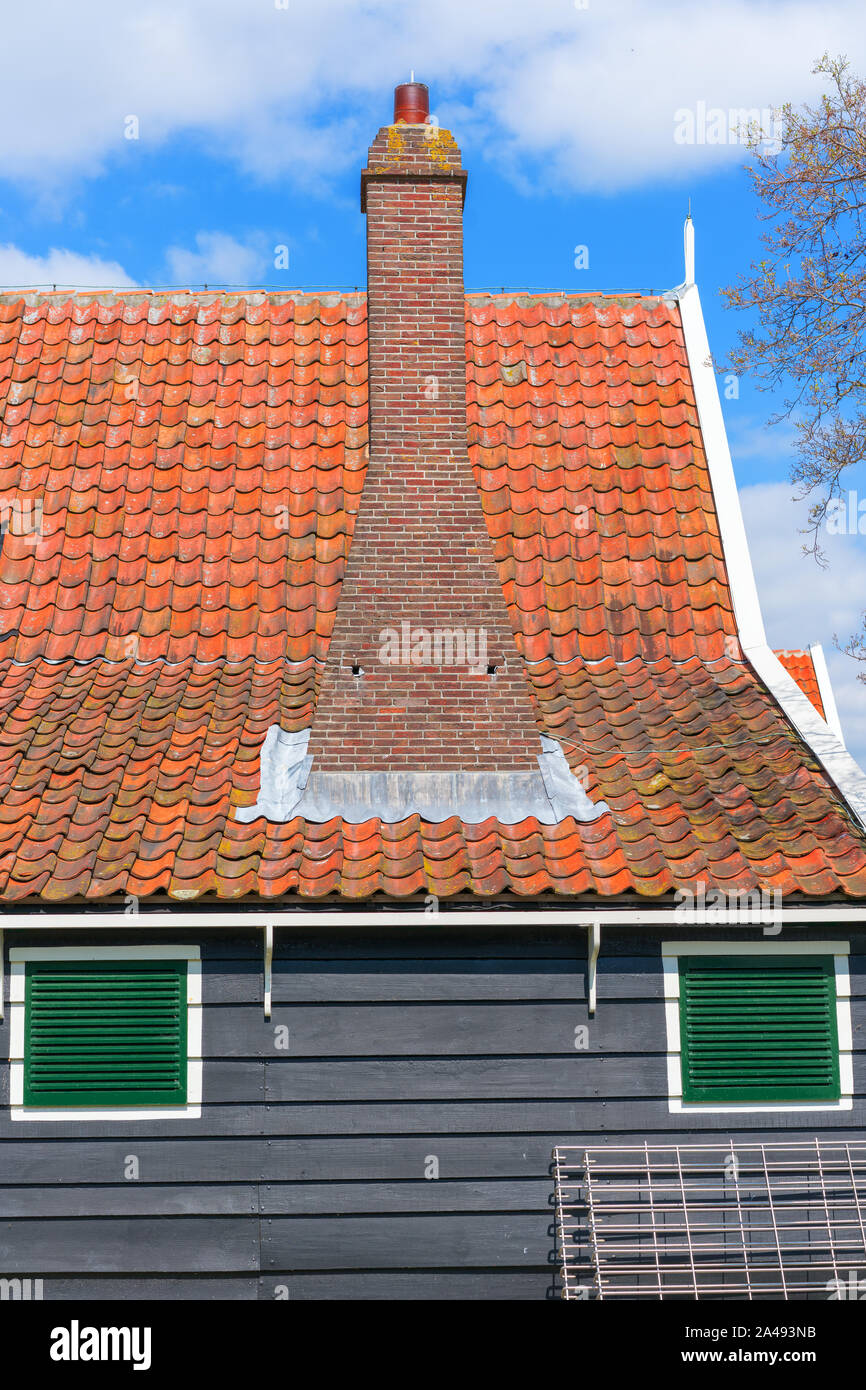 A typical Dutch house with red roof tiles and a brick mantelpiece Stock ...