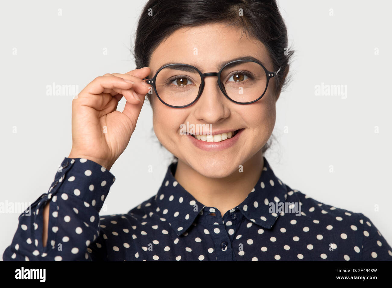 Portrait Of Indian Girl In Glasses Posing On Grey Background Stock
