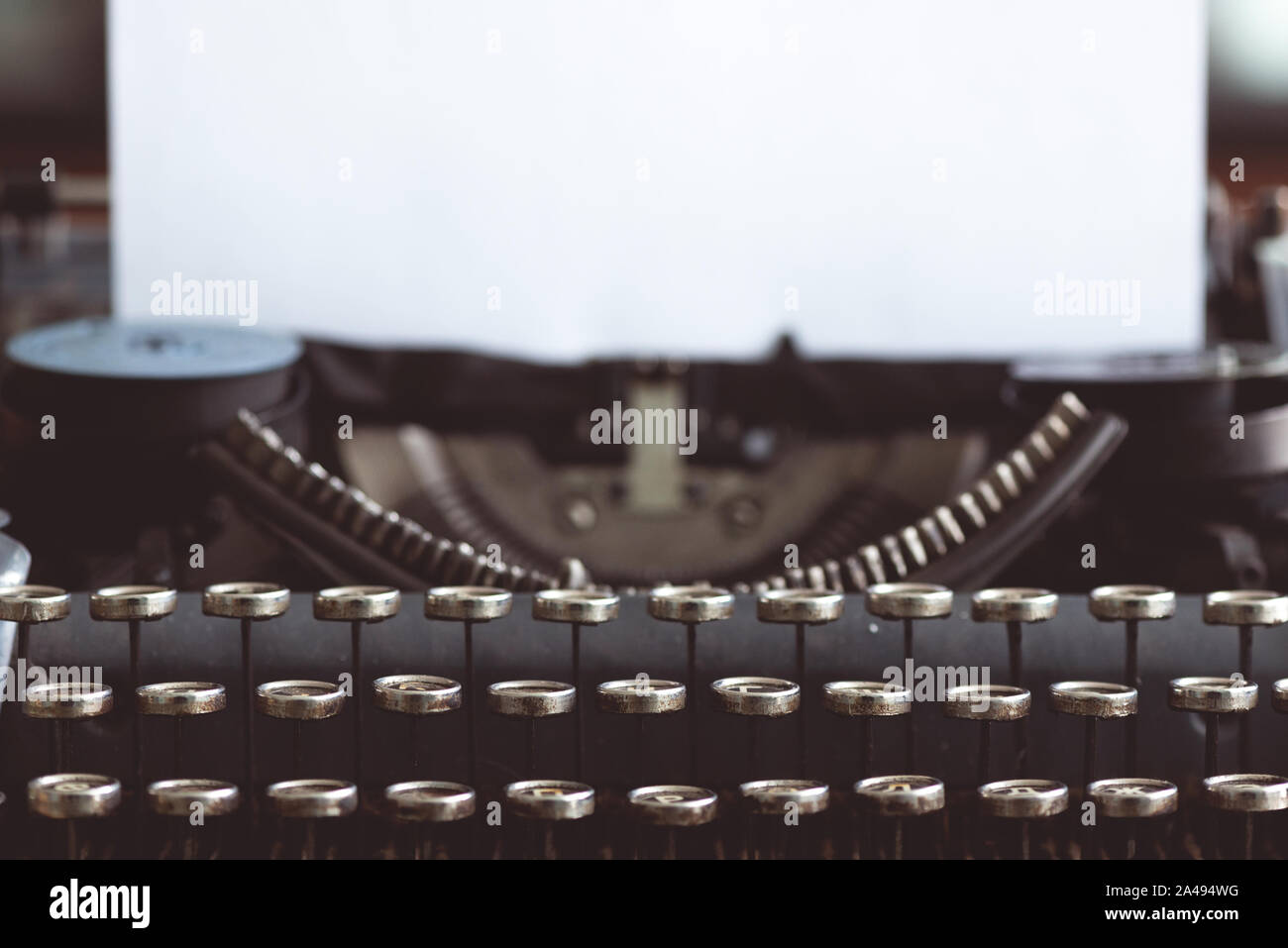 Typewriter with blank paper page with copy space Stock Photo - Alamy