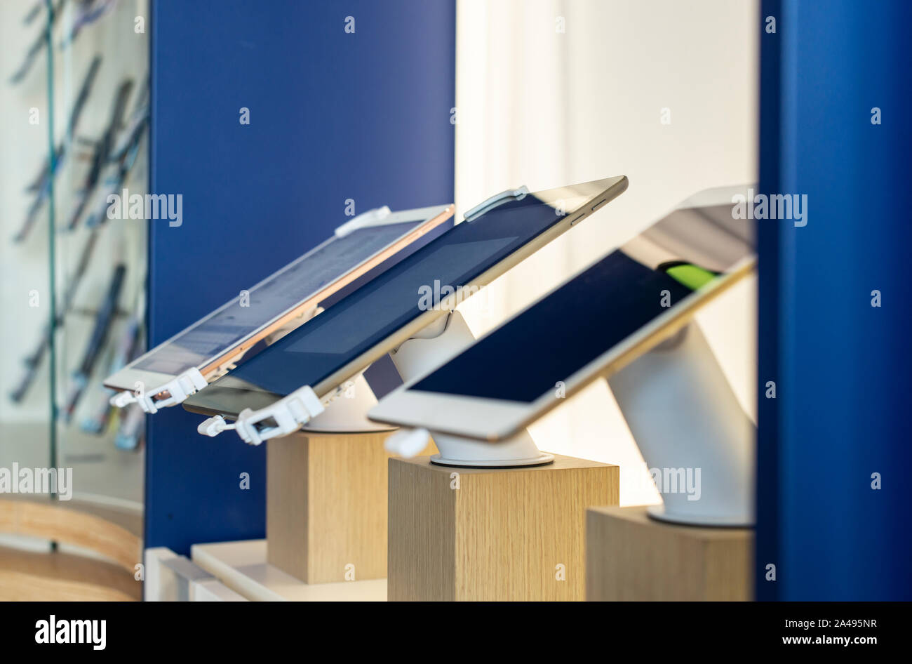 Cell Phones on shelf in telecommunication shop. Lights over GSM phones ...