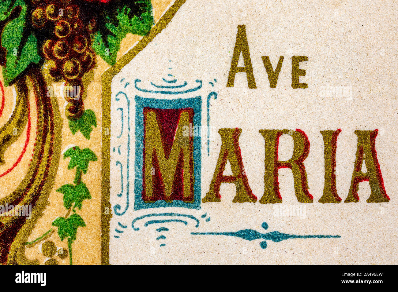Ave Maria painted in golden letters in an old holy book, greeting ...